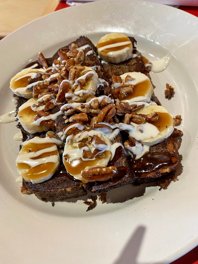 Banana nut bread French toast that makes you question why regular bread even exists. Those pecans deserve a standing ovation.