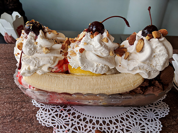 Three scoops of happiness crowned with cherries, nuts, and enough whipped cream to make diet plans temporarily disappear.