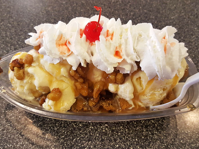 Behold the banana split in its natural habitat—a gleaming dish of ice cream, caramel, nuts, and whipped cream topped with the ceremonial cherry.