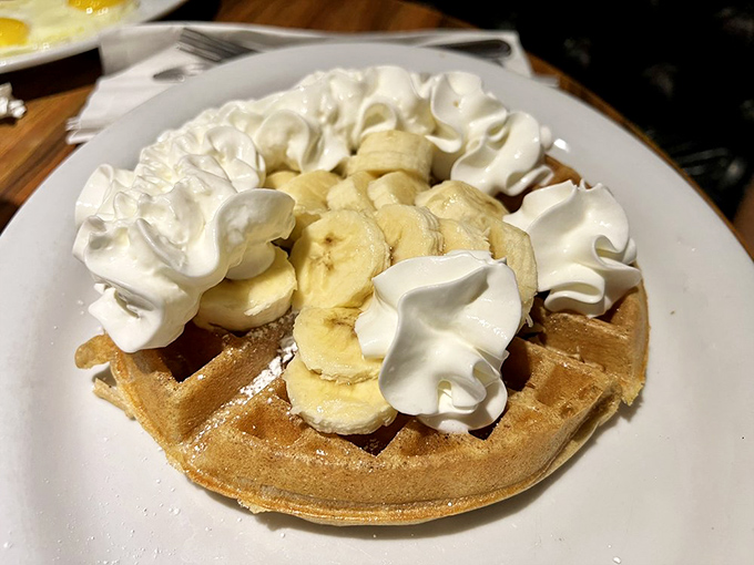 That banana-topped waffle is wearing whipped cream like it's dressed for a party &ndash; and you're invited.