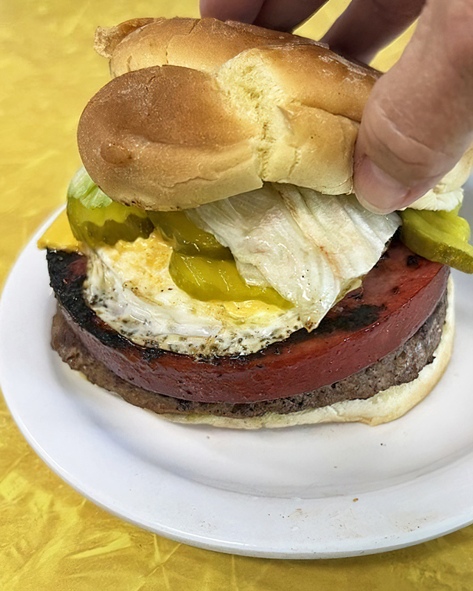 The Barnyard Burger defies gravity and good manners&mdash;a glorious stack demanding both hands, several napkins, and absolutely zero regrets.