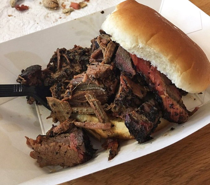 This isn't just a sandwich; it's a monument to brisket achievement. The bread is merely a delivery system.