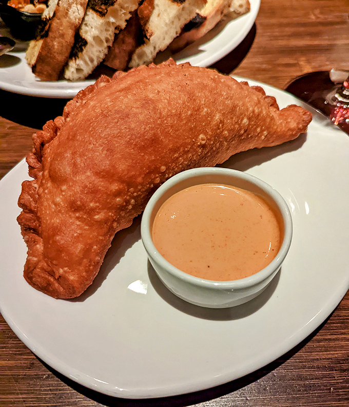 This empanada isn't just fried&mdash;it's transformed into a golden pocket of joy that makes your taste buds do the tango.