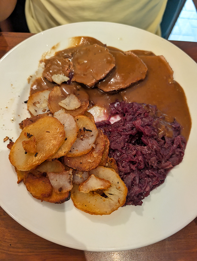 Red cabbage and fried potatoes flanking sauerbraten gravy&mdash;like delicious bodyguards protecting the tender beef from fork-wielding attackers.