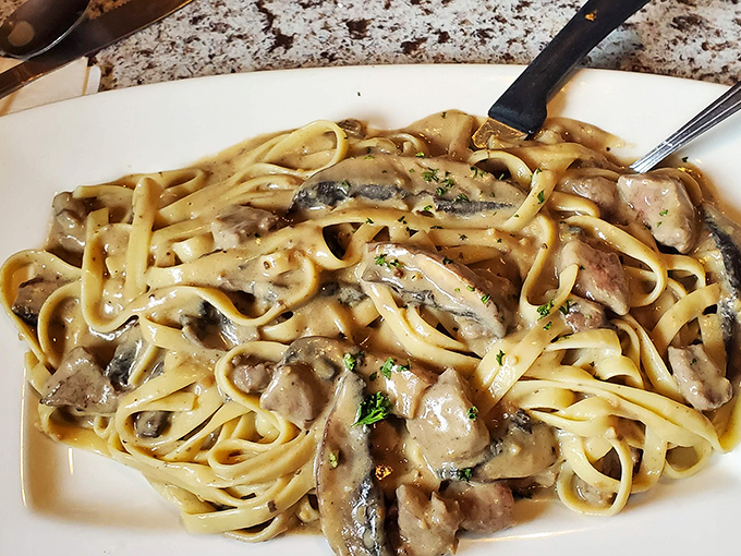 Fettuccine that doesn't just sit on the plate&mdash;it beckons, whispering promises of mushroom-infused bliss and tender beef.