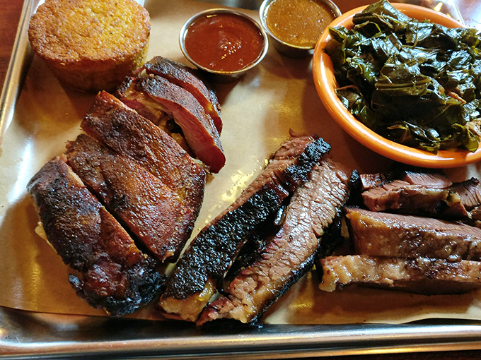 Brisket with that perfect smoke ring and cornbread that doesn't know whether it's bread or cake. The greens provide the illusion of virtue.