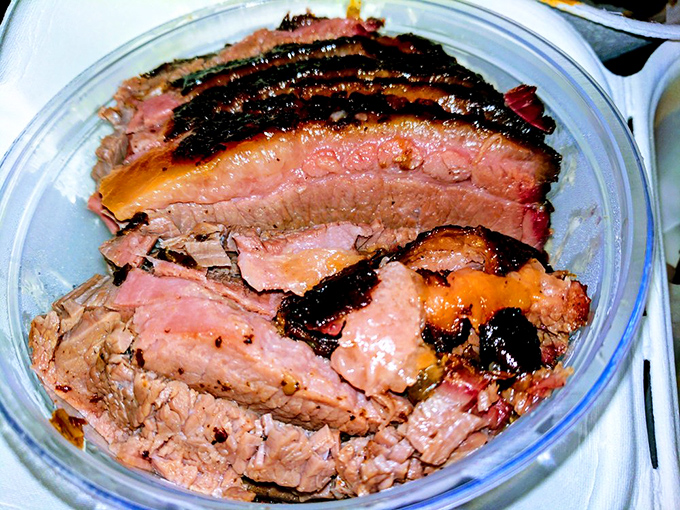 Brisket with a smoke ring so perfect it could make a Texan weep with joy. This isn't just meat; it's a time capsule of flavor.