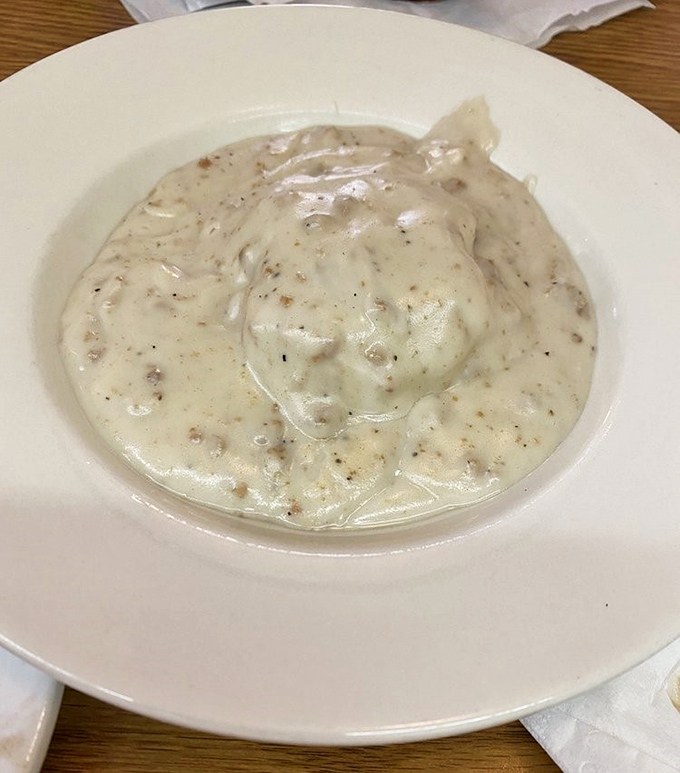 Biscuits and gravy so creamy and rich, it's like someone turned comfort into a physical state of matter that you can eat with a spoon.