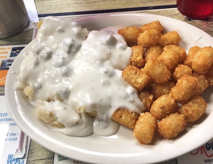 Biscuits swimming in creamy country gravy alongside golden tater tots&mdash;a breakfast combination that should be in the Southern Food Hall of Fame.
