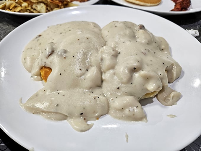 Biscuits and gravy so generous they're practically hidden under a blanket of creamy, peppery goodness&mdash;the breakfast equivalent of a warm hug.