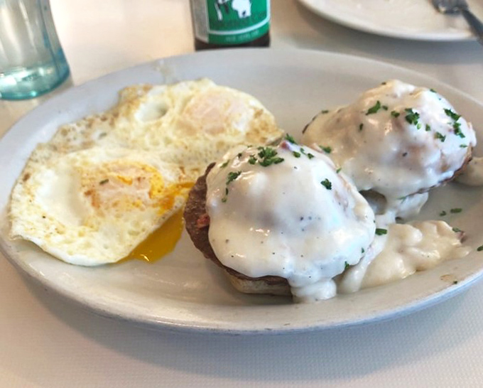 Biscuits and gravy with a perfectly fried egg&mdash;the breakfast equivalent of a warm hug from your favorite grandma on a cold Wisconsin morning.