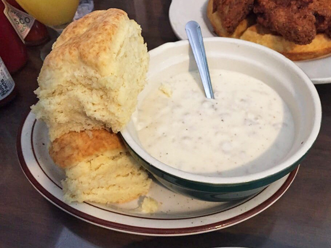 This biscuit isn't just splitting at the seams&mdash;it's having an existential crisis about whether to dive into that creamy gravy or be eaten on its own.