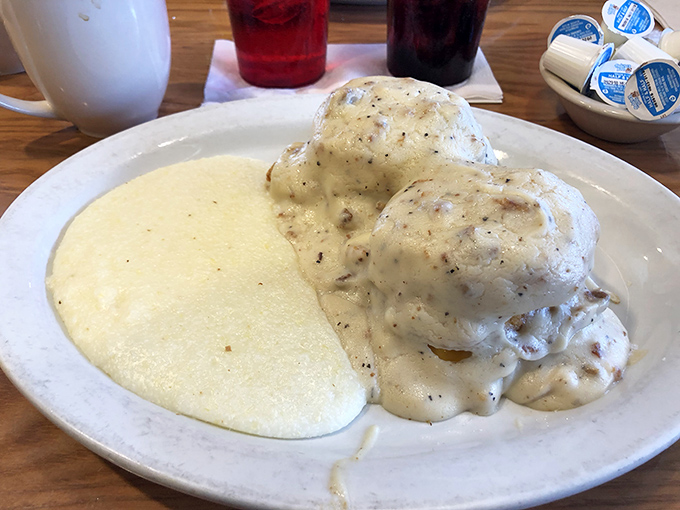 Behold the crown jewel – biscuits smothered in creamy sausage gravy alongside grits. Southern comfort doesn't get more authentic than this.