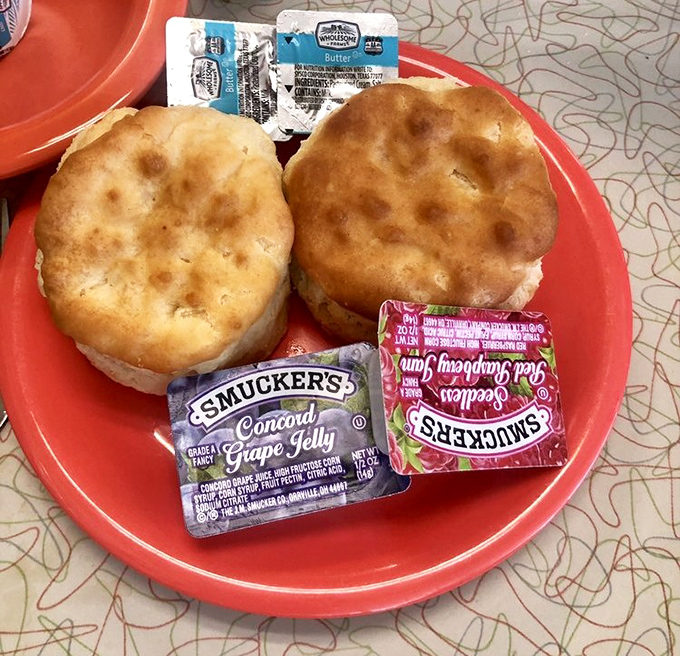 Biscuits so fluffy they could float away if not anchored by those packets of jam. These golden-topped beauties are the cornerstone of any proper Southern breakfast.