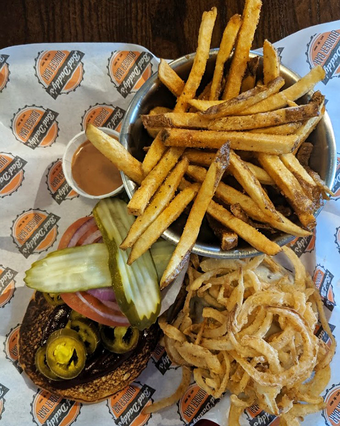 Hand-cut fries, crispy onion strings, and a perfectly assembled burger—a trio so harmonious they could release their own album.