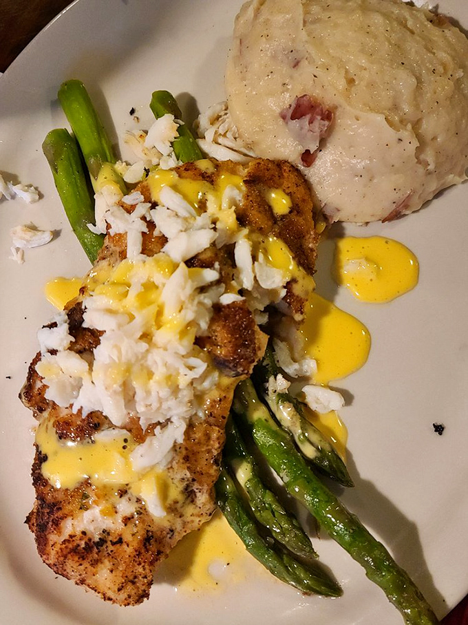 This blackened fish with crab topping isn't just dinner—it's edible artwork. The asparagus provides the perfect green counterpoint to all that seafood glory.