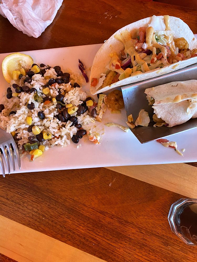 Blackened shrimp tacos so good you'll contemplate ordering a second round before finishing your first. That rice has clearly found its purpose in life.