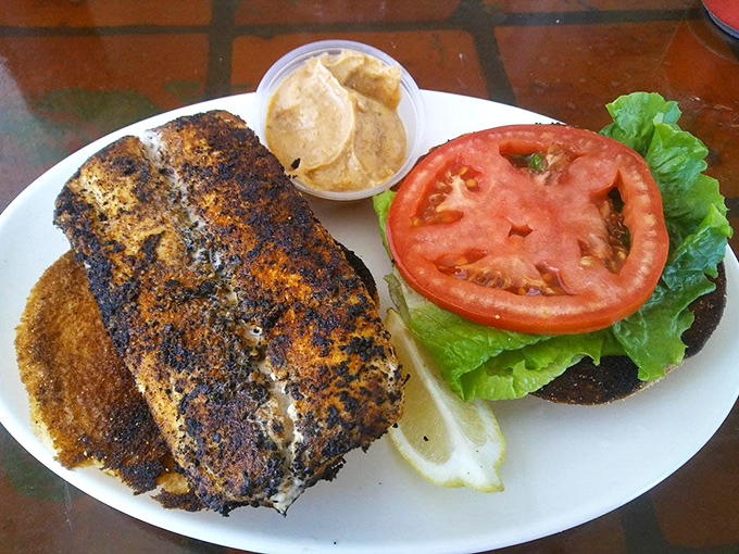 This blackened mahi sandwich isn't just food&mdash;it's Florida on a plate. The seasoning has more character than most Netflix originals.