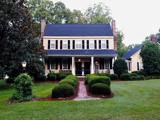 This classic Southern home with its perfect symmetry and meticulous boxwood garden looks like it's waiting for a scene from "Steel Magnolias" to unfold on its porch.