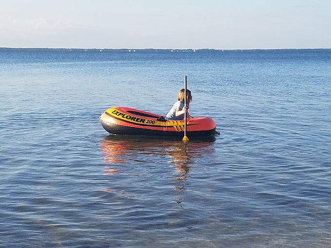 Solo exploration in calm waters&mdash;proof that sometimes the best company is just you, a paddle, and the gentle lapping of waves.