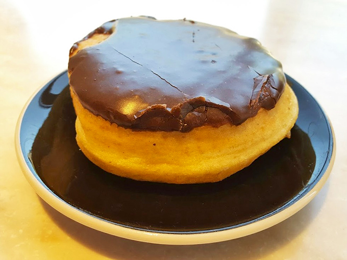This Boston cream donut looks like it graduated summa cum laude from pastry school with honors.
