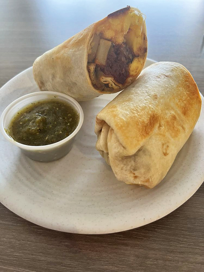 Breakfast burritos should be knighted for their service to humanity. This golden-brown champion with its side of salsa verde deserves a medal.