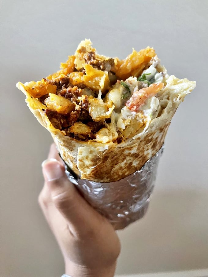 Behold the breakfast burrito in its natural habitat&mdash;halfway to your mouth! The cross-section reveals the perfect ratio of eggs, potatoes, and chorizo in tortilla harmony.