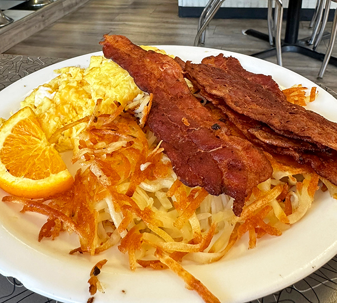 Breakfast perfection isn't complicated &ndash; just perfectly crispy hash browns, eggs with sunset-yellow yolks, and bacon that could make a vegetarian question their life choices.