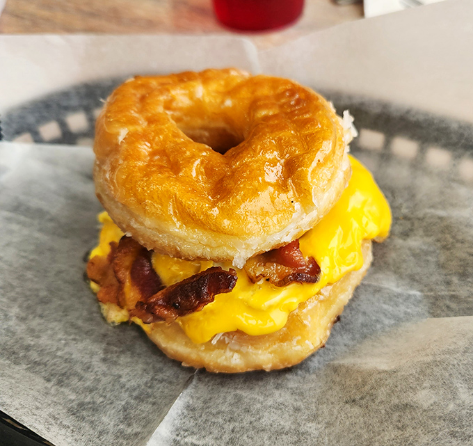 The breakfast sandwich that answers the eternal question: "Why choose between a donut and eggs?" Pure morning genius on a plate.