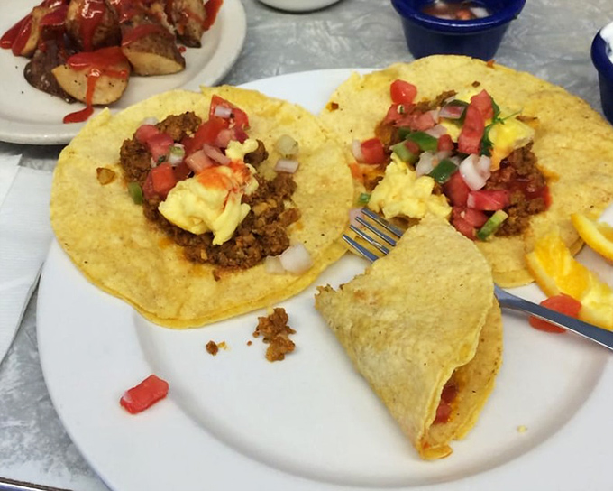 Breakfast tacos that bring a fiesta to your morning. The scrambled eggs and pico de gallo are having a party, and your taste buds are invited.