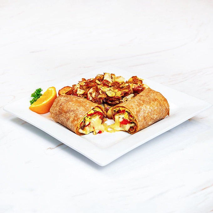 Breakfast's greatest hits wrapped in a tortilla hug. The melty cheese escape is not an accident but the mark of breakfast engineering excellence.