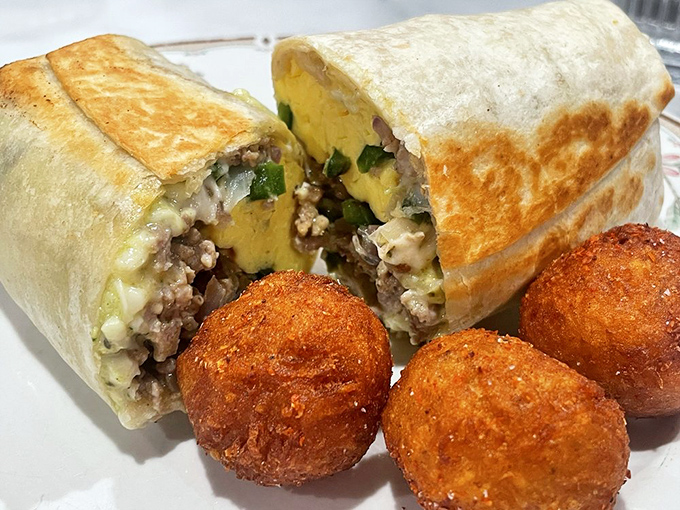 Behold the architectural marvel that is their breakfast burrito &ndash; where structural integrity meets flavor harmony, with crispy potato spheres standing guard.