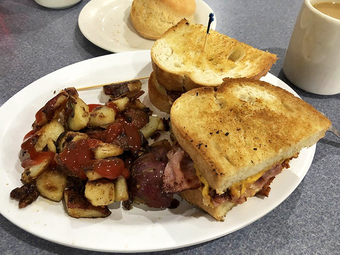 This breakfast sandwich stands tall like a delicious skyscraper built on a foundation of pure satisfaction.
