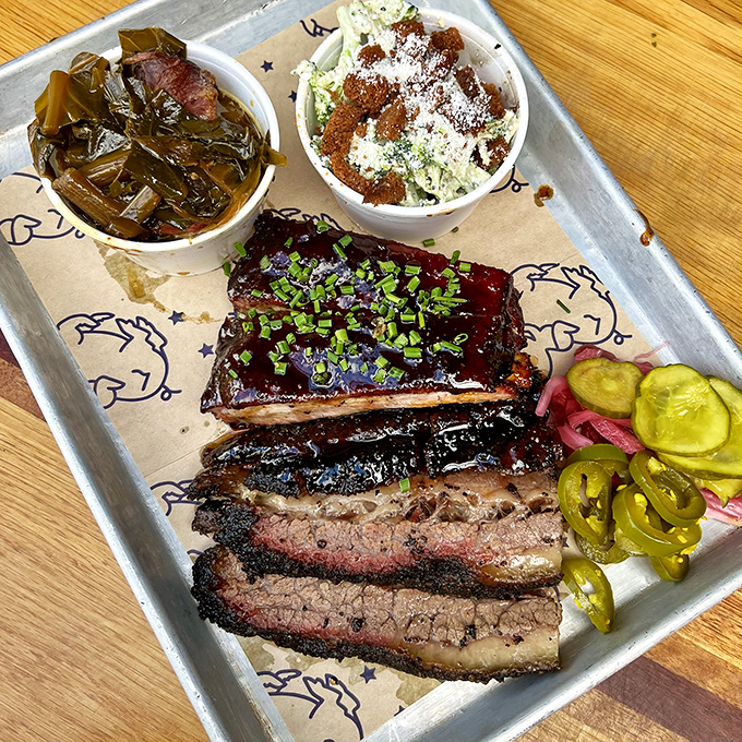 BBQ platter perfection! Brisket with that textbook bark alongside collards and slaw&mdash;proof that balance in the universe does exist. 