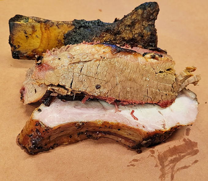 Behold the holy trinity of Texas barbecue&mdash;brisket with that telltale smoke ring, a hint of rib, and a bark so perfect it deserves its own art exhibition.