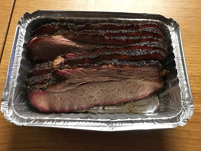 Behold the holy grail of barbecue: brisket with that perfect pink smoke ring that makes meat lovers weak in the knees.