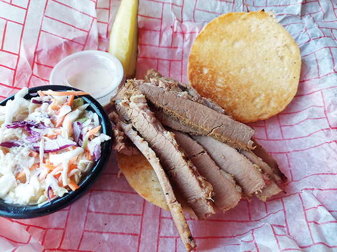 Brisket sliced so perfectly it could make a Texan weep, with that pink smoke ring that's the BBQ equivalent of Olympic gold.