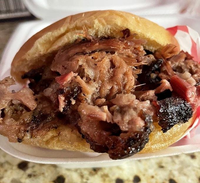 The sandwich that ruins all other sandwiches. Pillowy bun cradling a mountain of brisket&mdash;it's the meat equivalent of a warm hug.