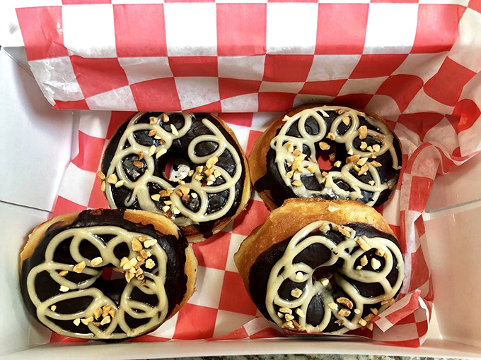Chocolate donuts with artistic white chocolate drizzles that would make Jackson Pollock proud. These aren't just eaten&mdash;they're experienced.
