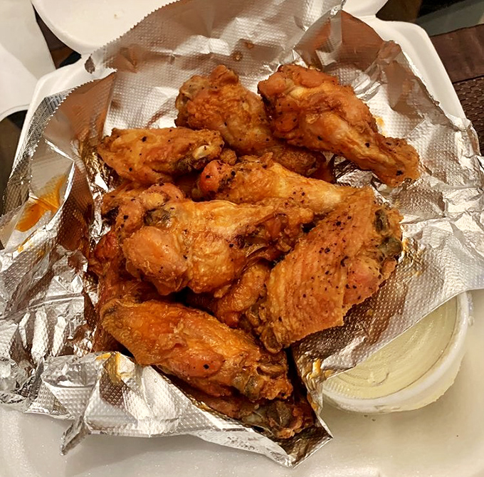 These wings aren't just crispy&mdash;they're having a meaningful relationship with that buffalo sauce. The blue cheese dip is standing by for moral support.