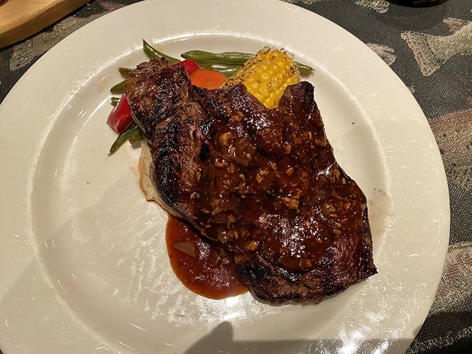 The buffalo ribeye arrives glistening with promise. Wild game that tastes this good makes you wonder why we ever settled for ordinary beef.