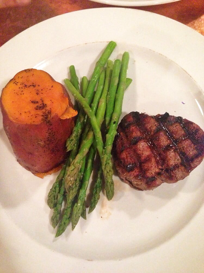 Buffalo tenderloin cooked to perfection, flanked by asparagus soldiers standing at attention. This plate doesn't just feed you&mdash;it respects you.