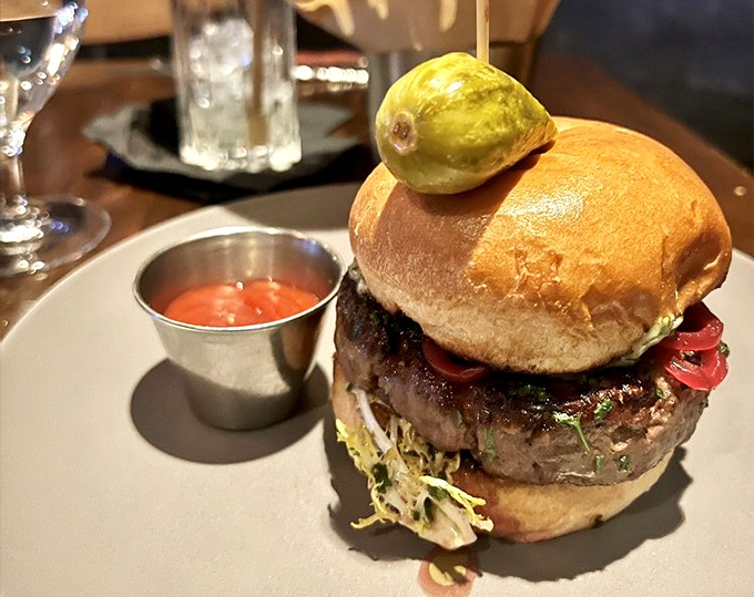 Not just a burger&mdash;a statement. That pickle spear standing tall like a flag planted on the summit of Mount Delicious.