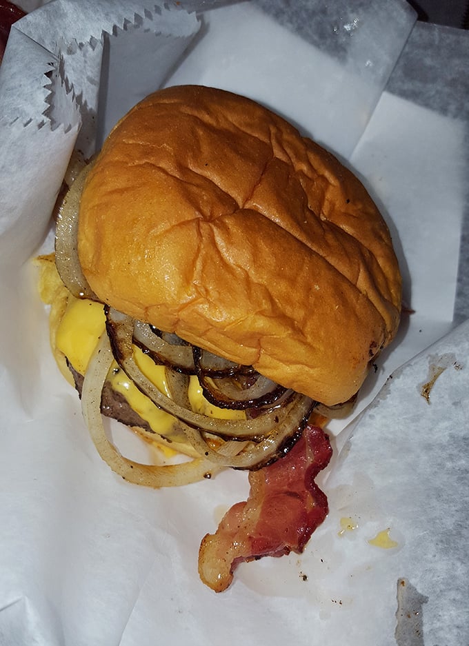 This burger means business &ndash; stacked high with grilled onions and enough cheese to satisfy your wildest cravings.
