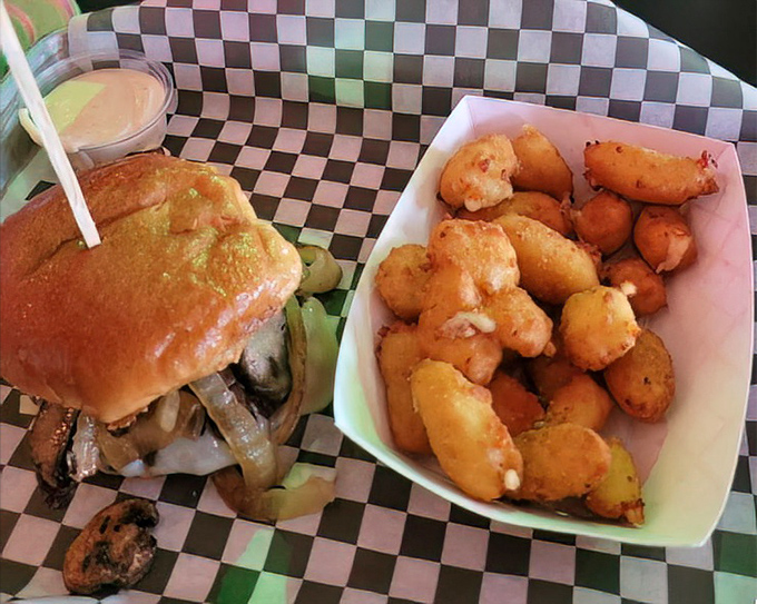 A burger that demands respect and a side of cheese curds that refuses to be ignored. Wisconsin would approve of this Georgia interpretation.