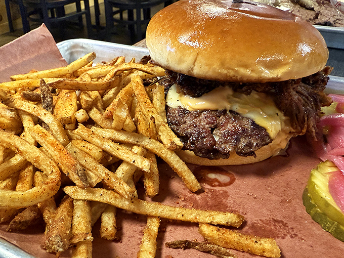 This isn't just a burger; it's a declaration of independence from boring lunches. Seasoned fries and house pickles complete this American masterpiece.