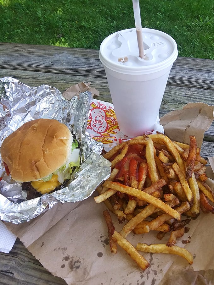 The holy trinity of American roadside dining: a perfectly proportioned burger, golden fries, and a milkshake thick enough to bend your straw.