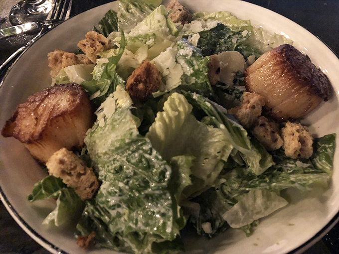 Caesar salad elevated to an art form&mdash;those perfectly seared scallops aren't just garnish, they're the supporting actors who steal the scene.