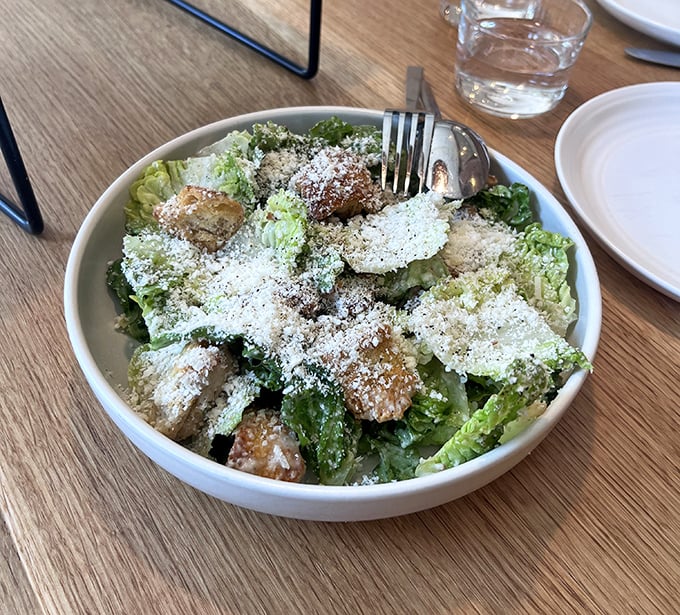 Not just any Caesar salad &ndash; this one's had an education. Crisp romaine, generous parmigiano, and croutons that actually deserve to be there.
