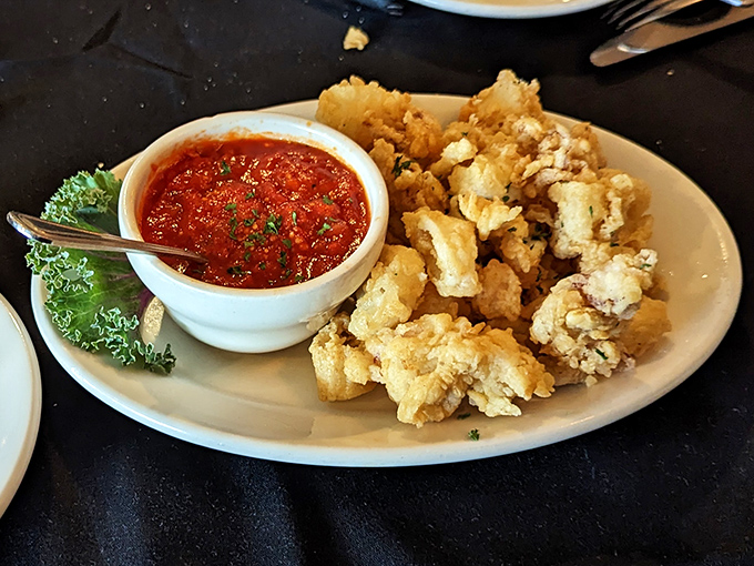 Lightly dusted calamari that actually tastes like seafood, not just fried batter. The marinara sauce is practically begging for a spoon.